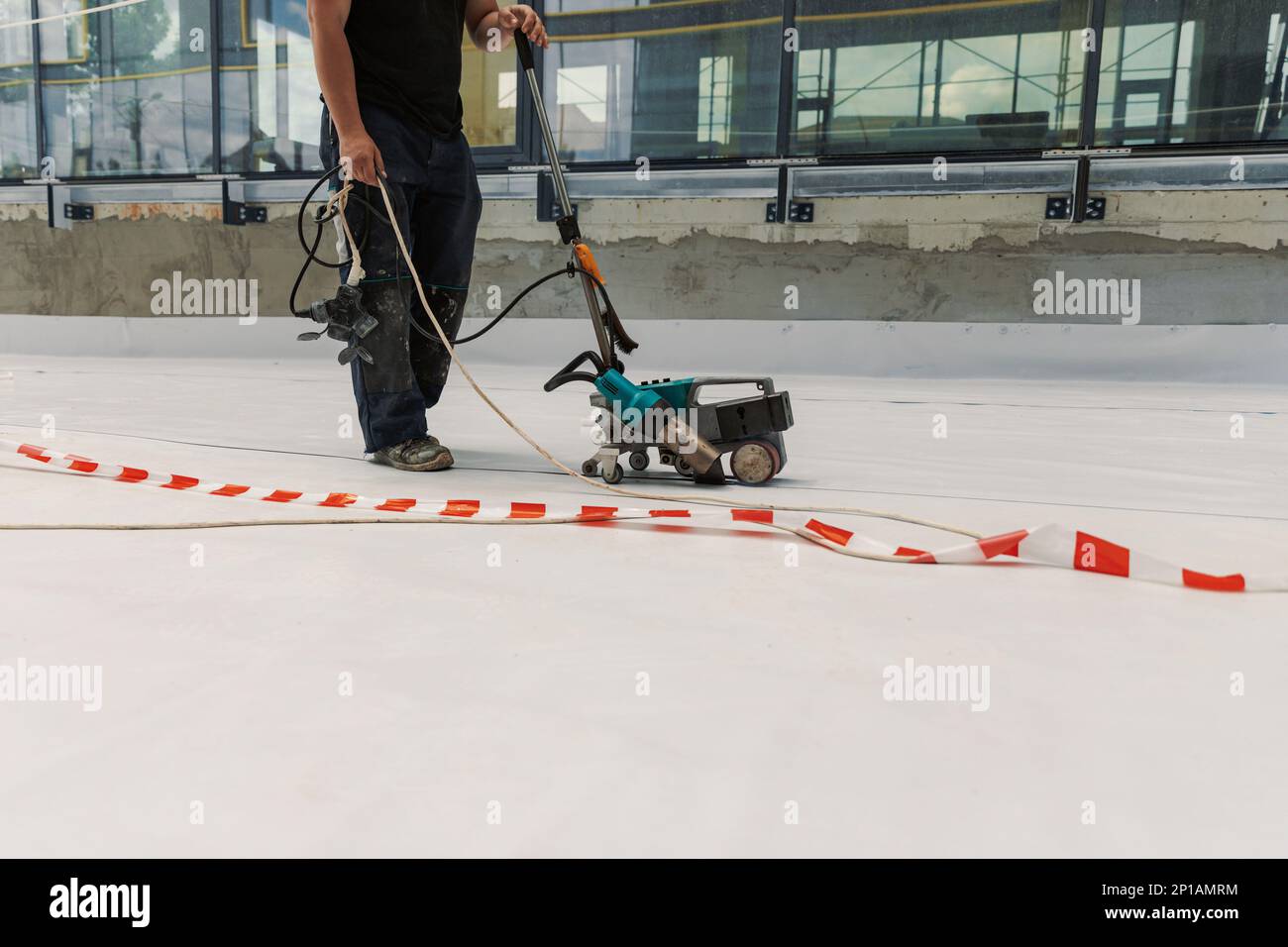 Worker welding pvc membrane by heater with welder machine Stock Photo ...