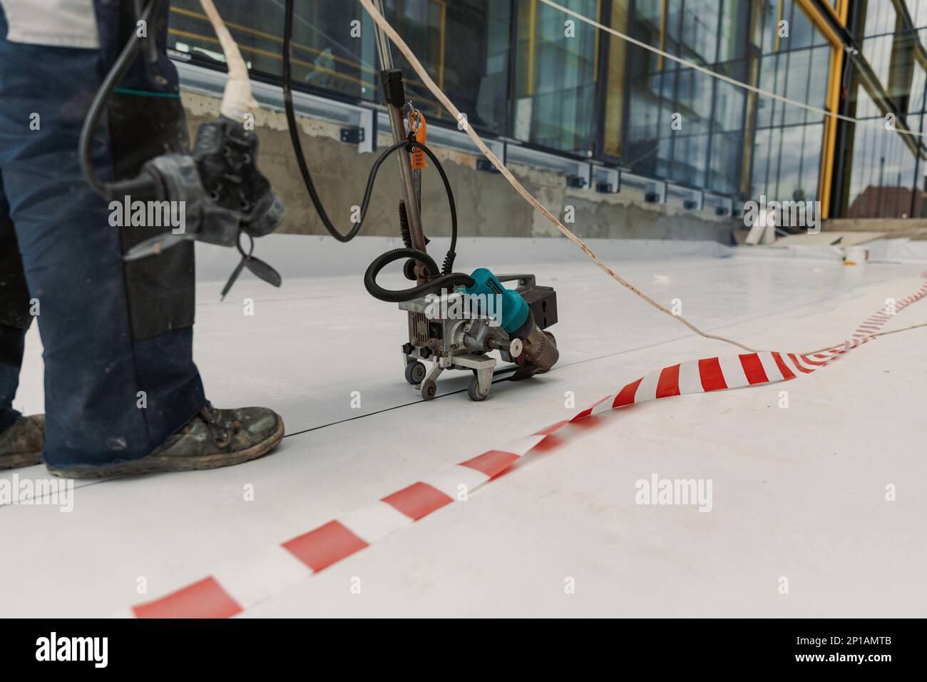 Worker welding pvc membrane by heater with welder machine Stock Photo ...