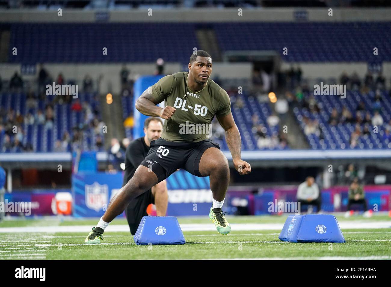 Auburn defensive lineman Colby Wooden runs a drill at the NFL football ...