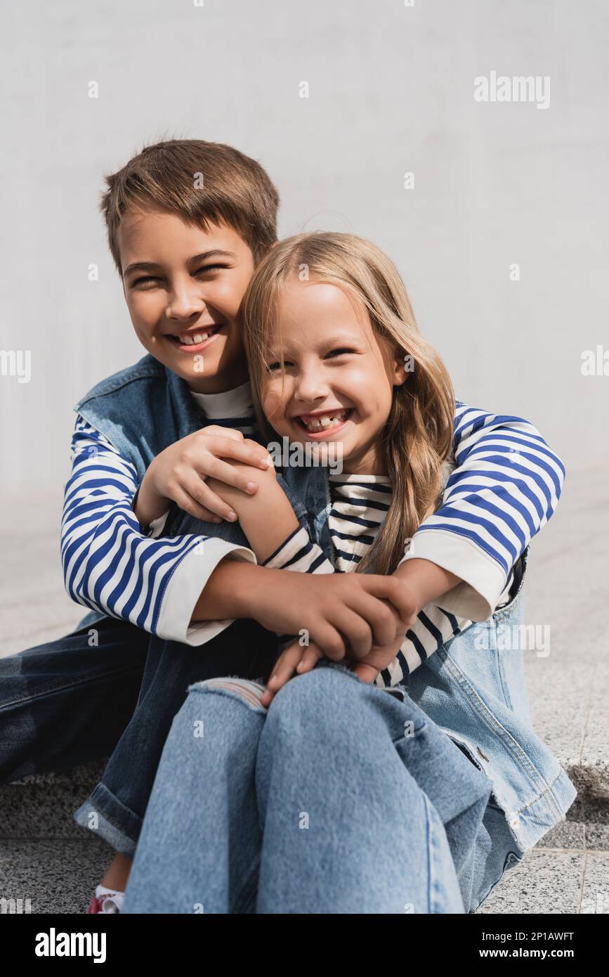 Cute preteen girl sitting hugging hi-res stock photography and images - Alamy