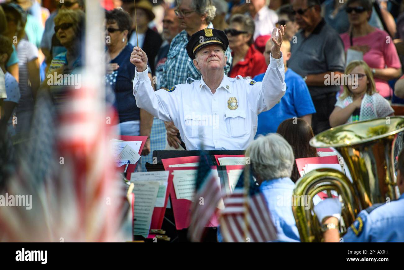 Capt. Robert Dynan conducts as the Minneapolis Police Band plays the ...