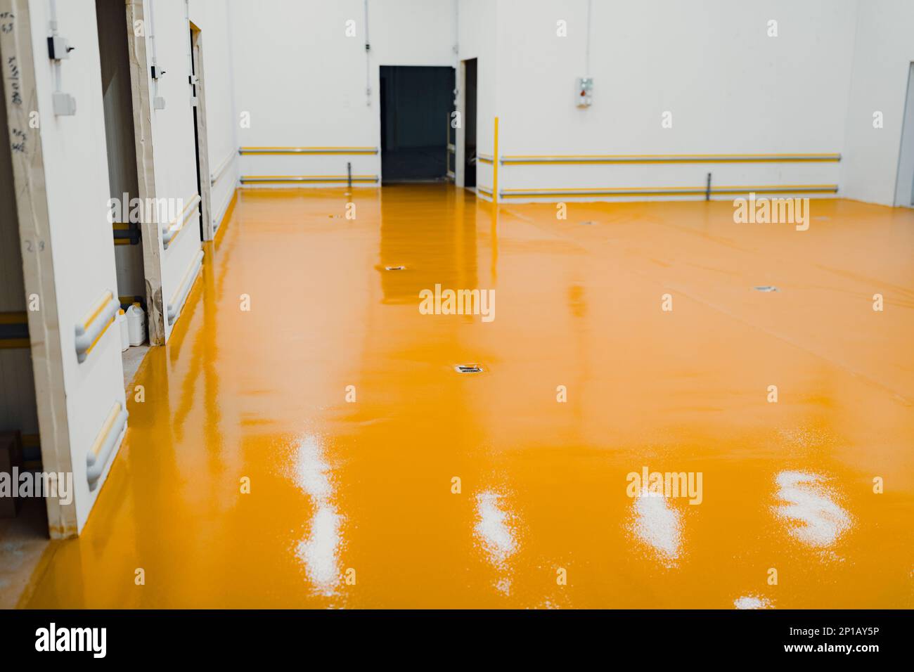 cold storage with new floor made of yellow epoxy resin Stock Photo - Alamy