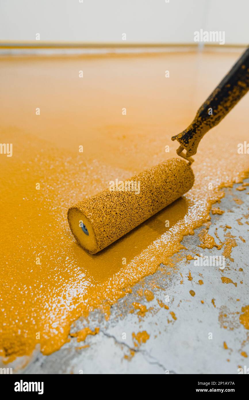 Tools used in epoxy floor painting Stock Photo - Alamy
