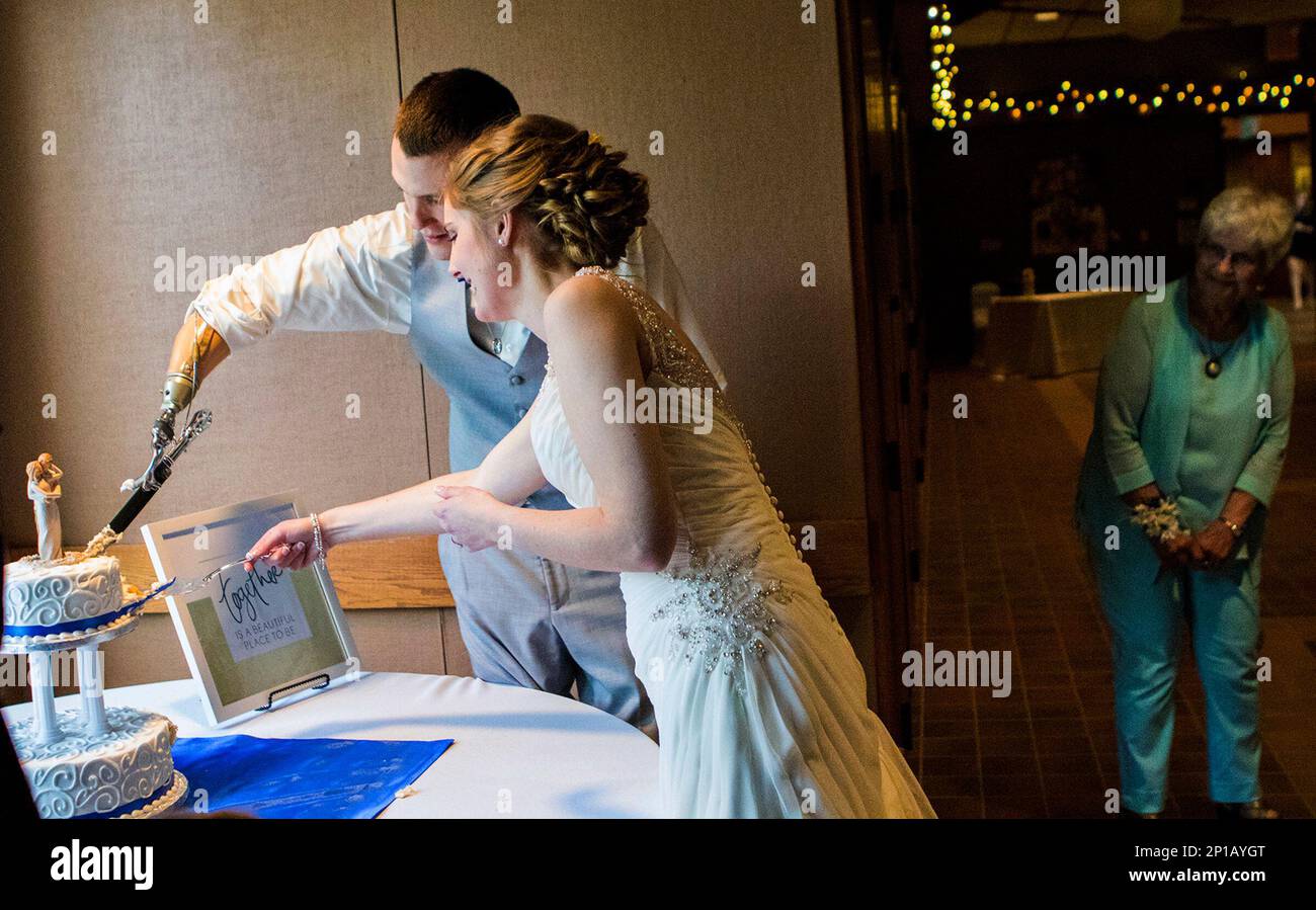 In this May 14, 2016, photo, a guest peers over at Ethan Menges and his ...