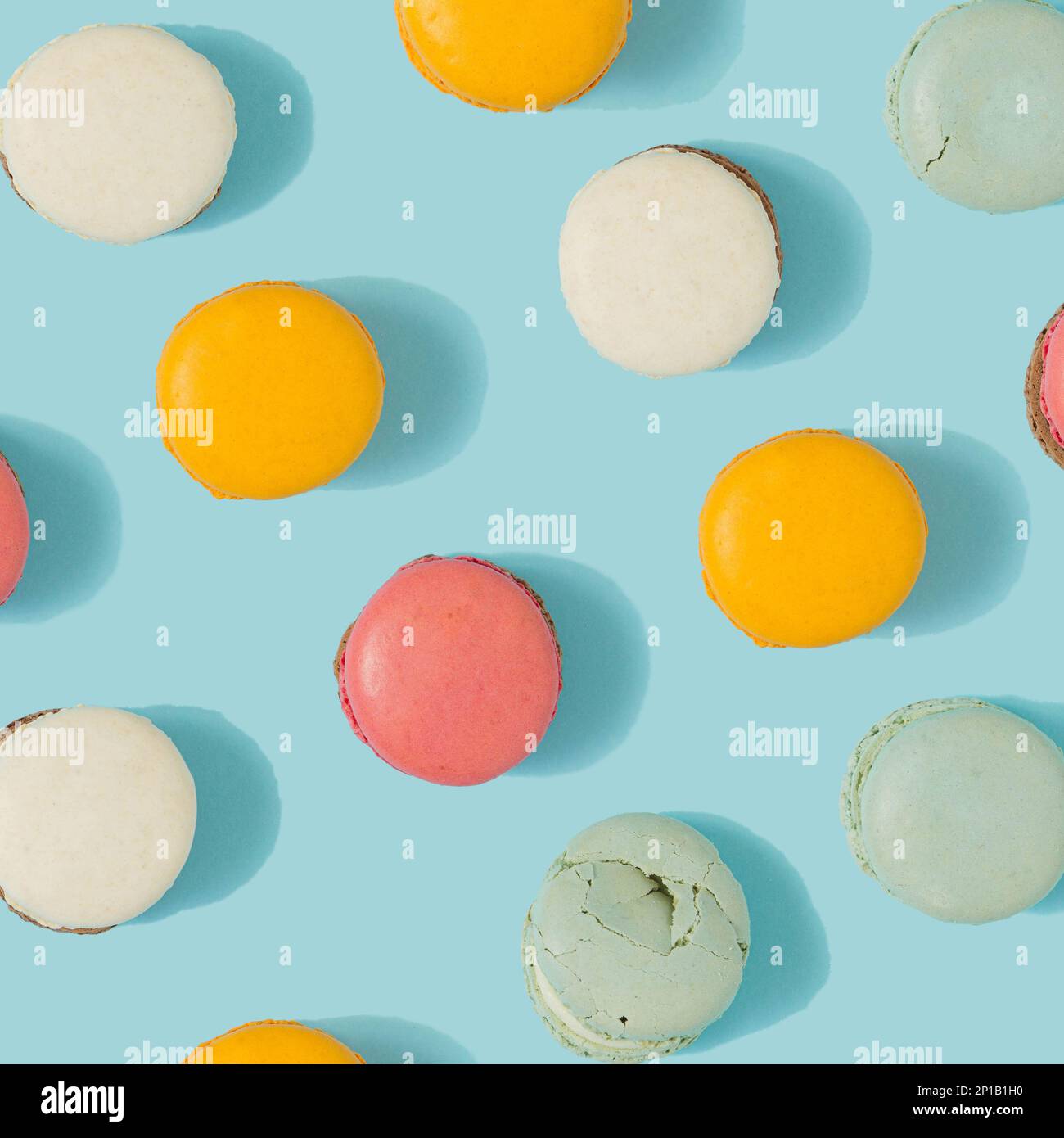 A collage of colorful macarons arranged in an aesthetically pleasing ...