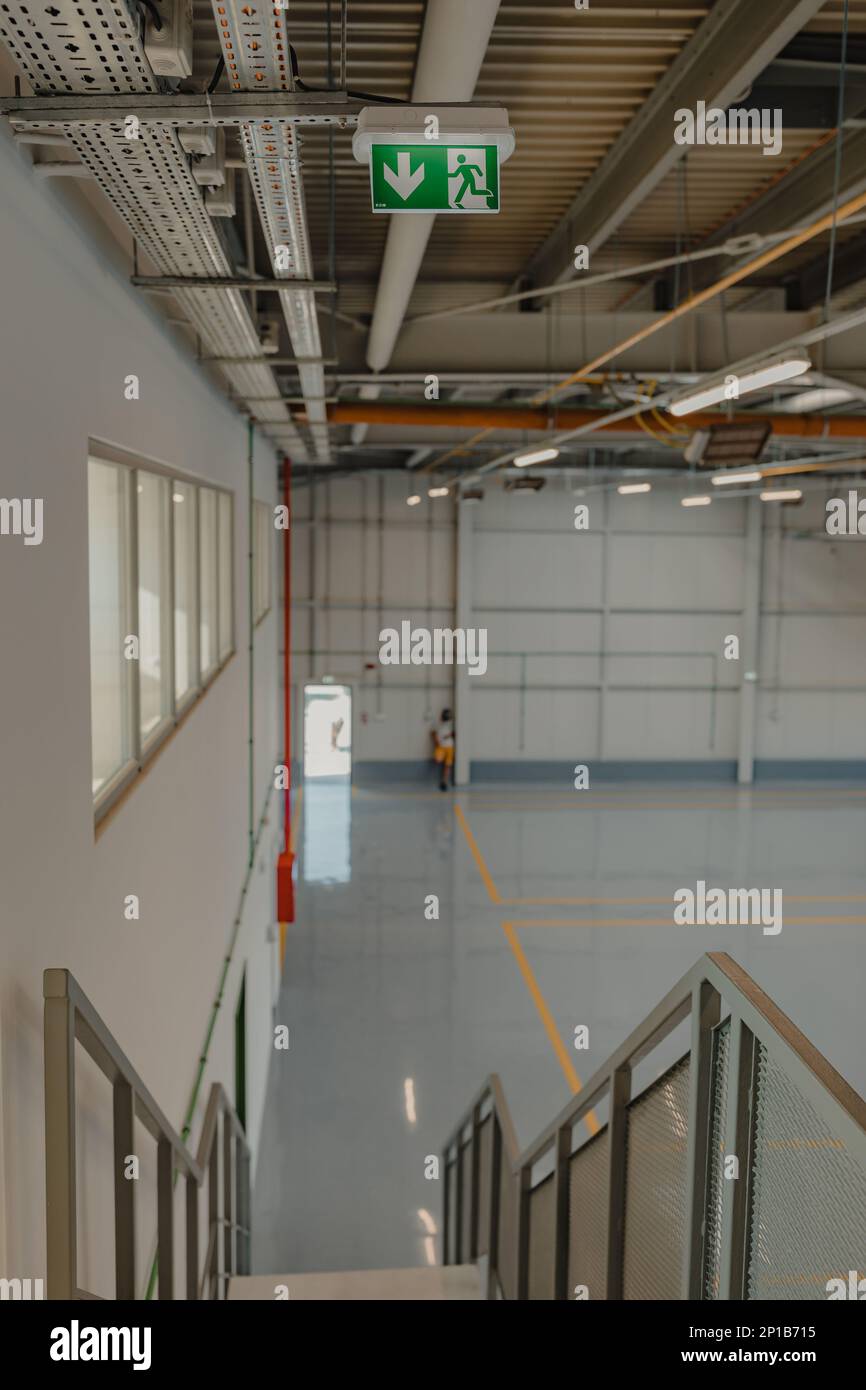 Stairs in a car workshop with exit markings Stock Photo - Alamy