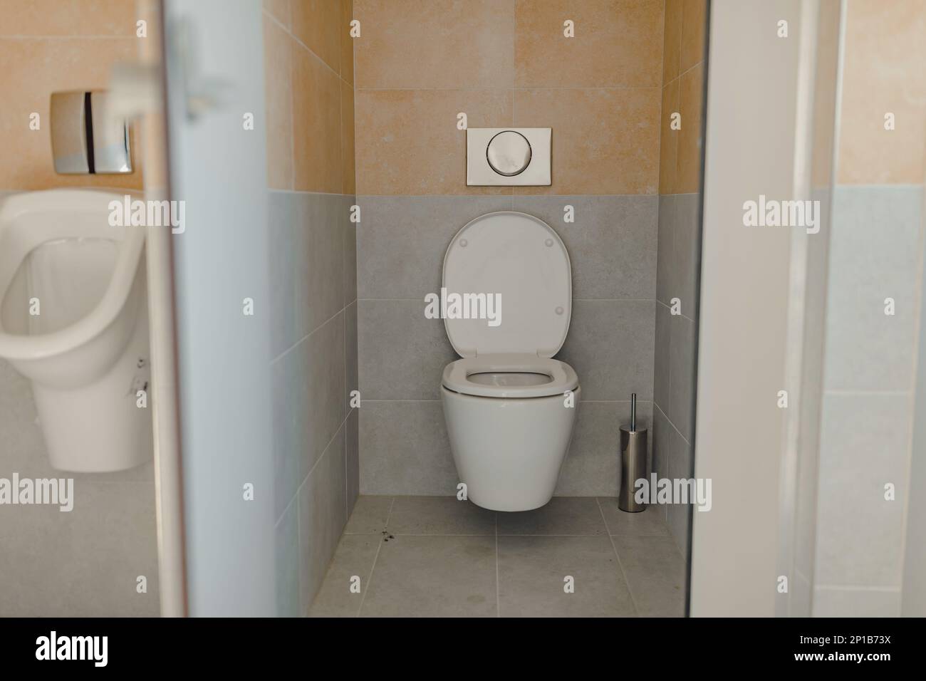 bathroom with shower, toilet and urinal for workers Stock Photo - Alamy