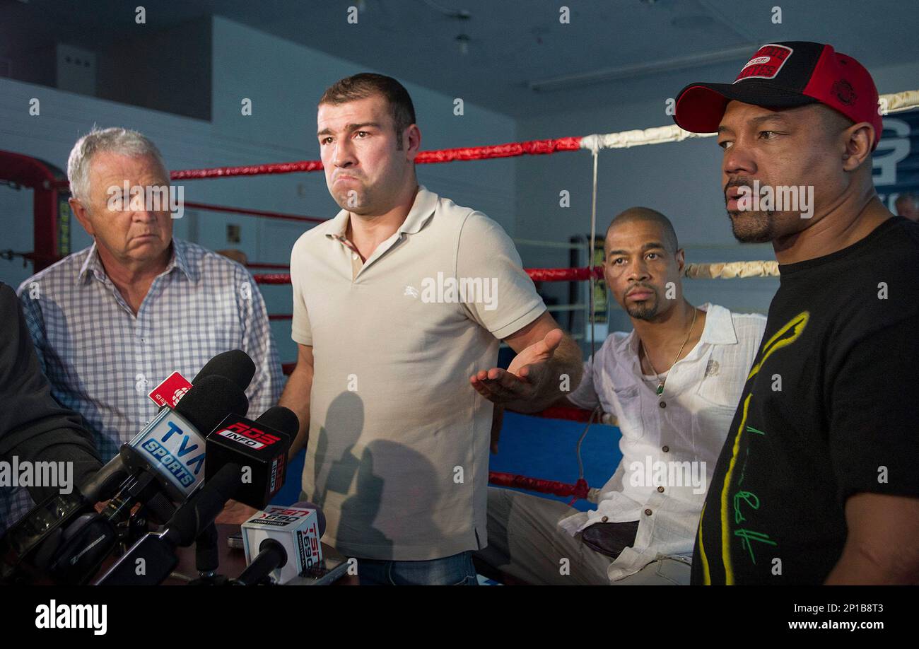 Boxer Lucian Bute, second from left, speaks to reporters in Montreal ...