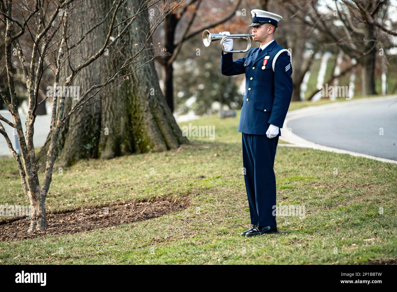A bugler from the U.S. Coast Guard Band plays "Taps" during a wreath ...