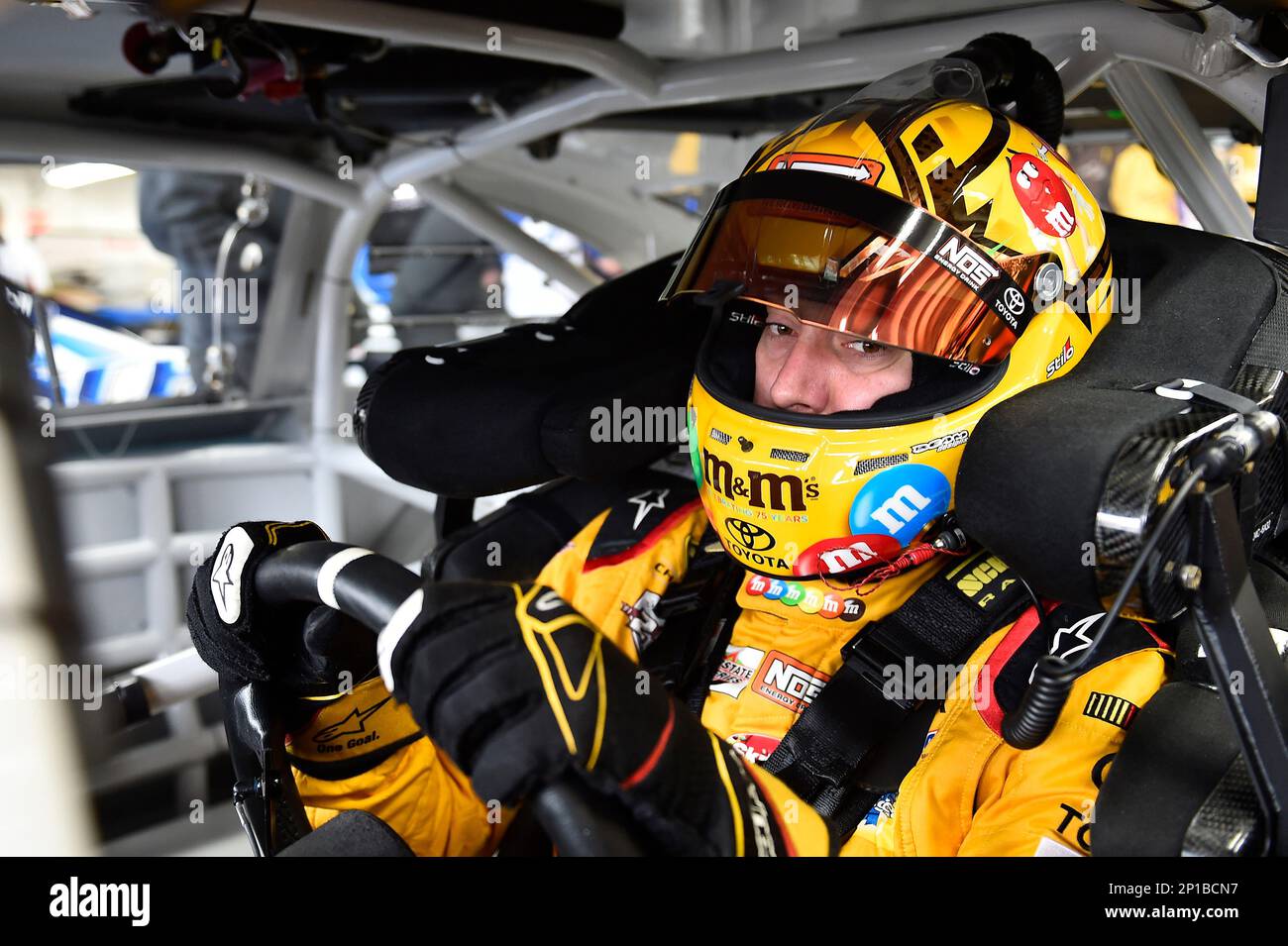 Kyle Busch, M&M's 75th Anniversary Camry (75), sits in his car during ...