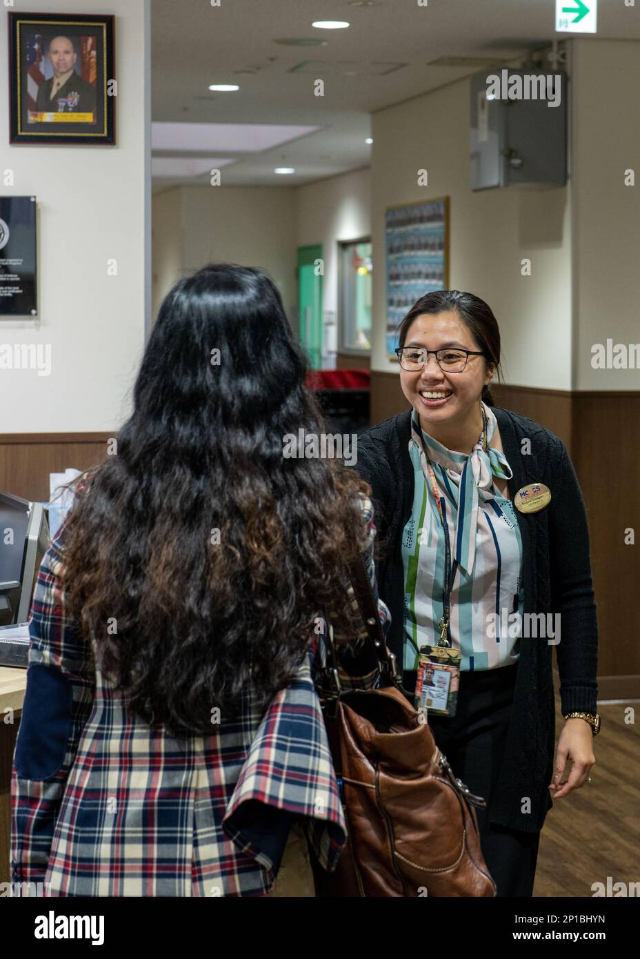 U.S. Navy Ombudsman-At-Large Junifer Thomas, left, introduces herself ...