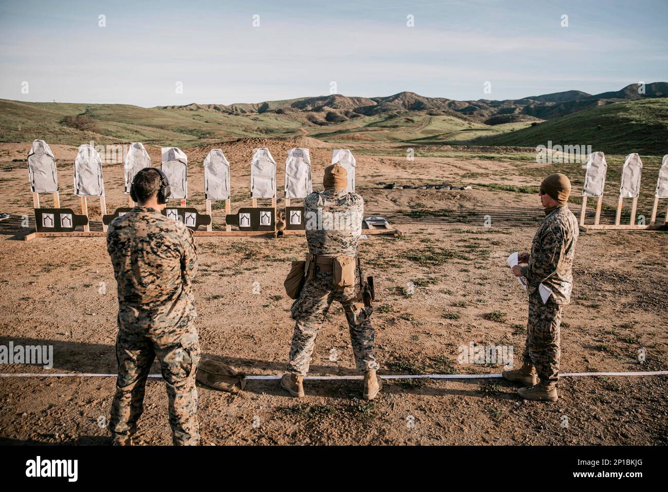 A U.S. Marine assigned to the 15th Marine Expeditionary Unit fires an ...