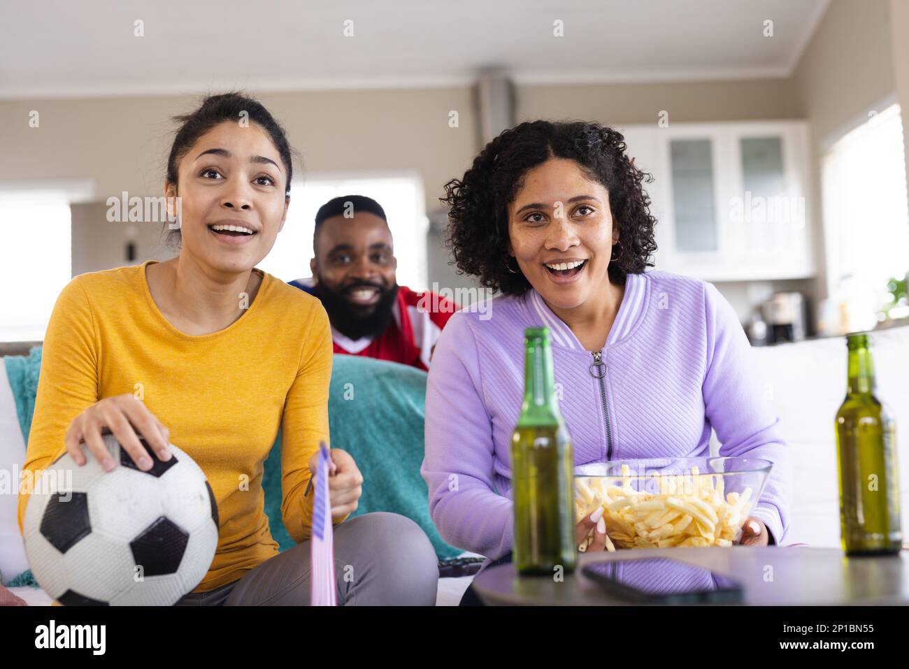 Watching football on sofa hi-res stock photography and images - Alamy