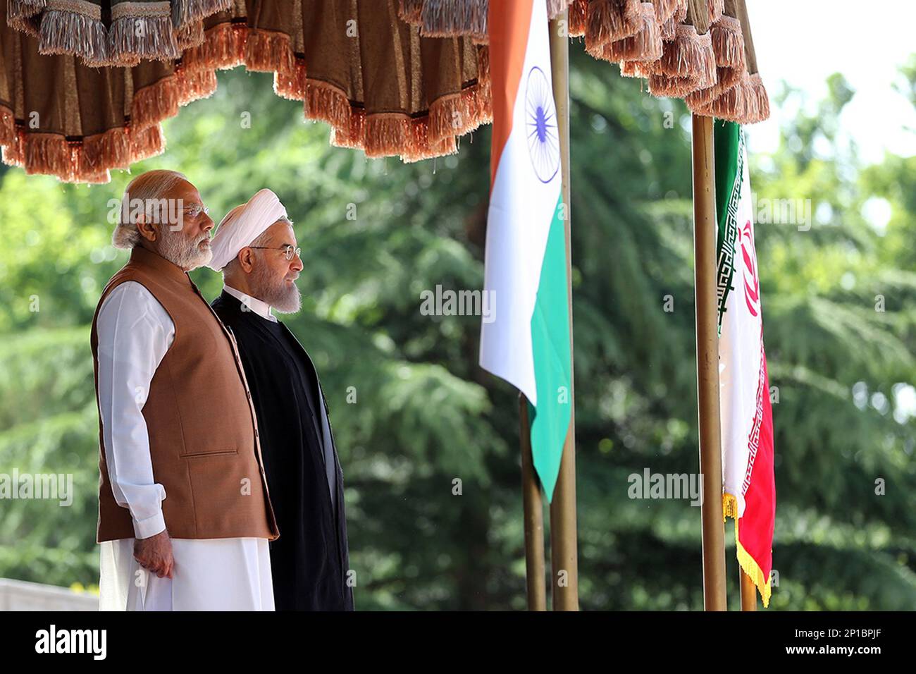 Indian Prime Minister Narendra Modi, left, stands with Iranian ...