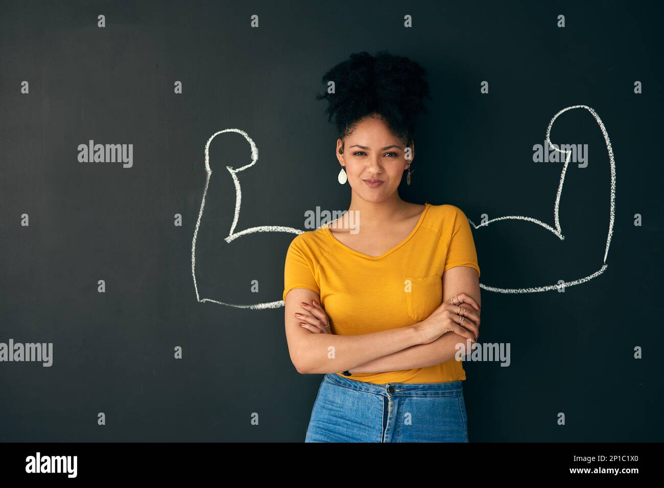 I am a strong woman. Shot of a woman posing with a chalk illustration ...
