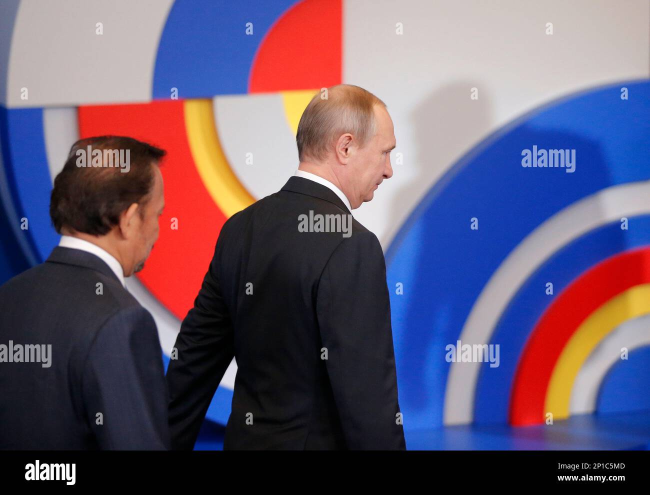 Russian President Vladimir Putin, right, arrives for a group photo ...