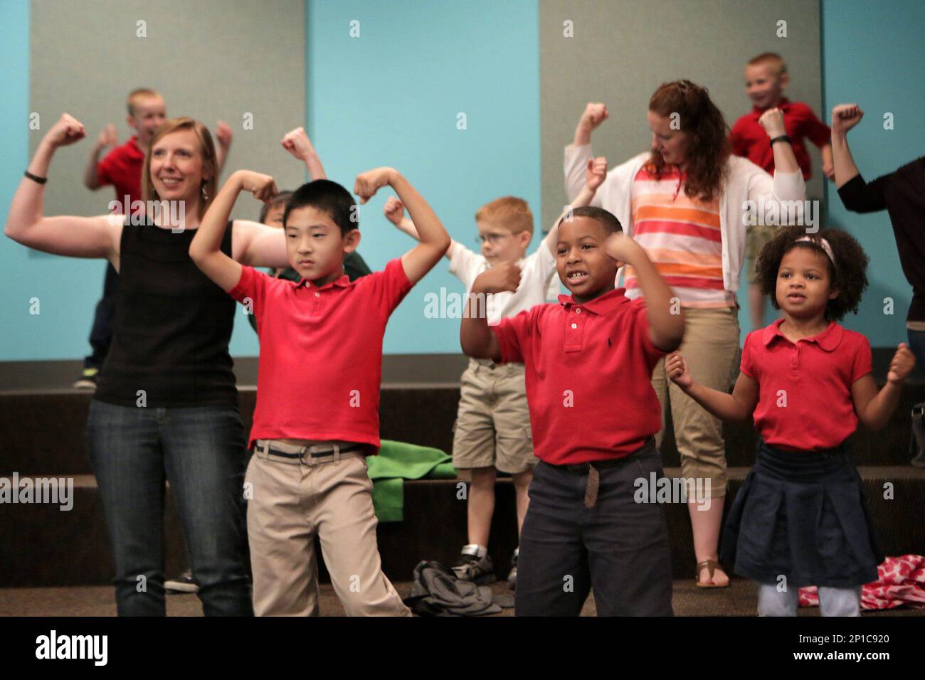 Frank Tian, from left, Emory Malone and Laia Ogun flex their muscles in ...