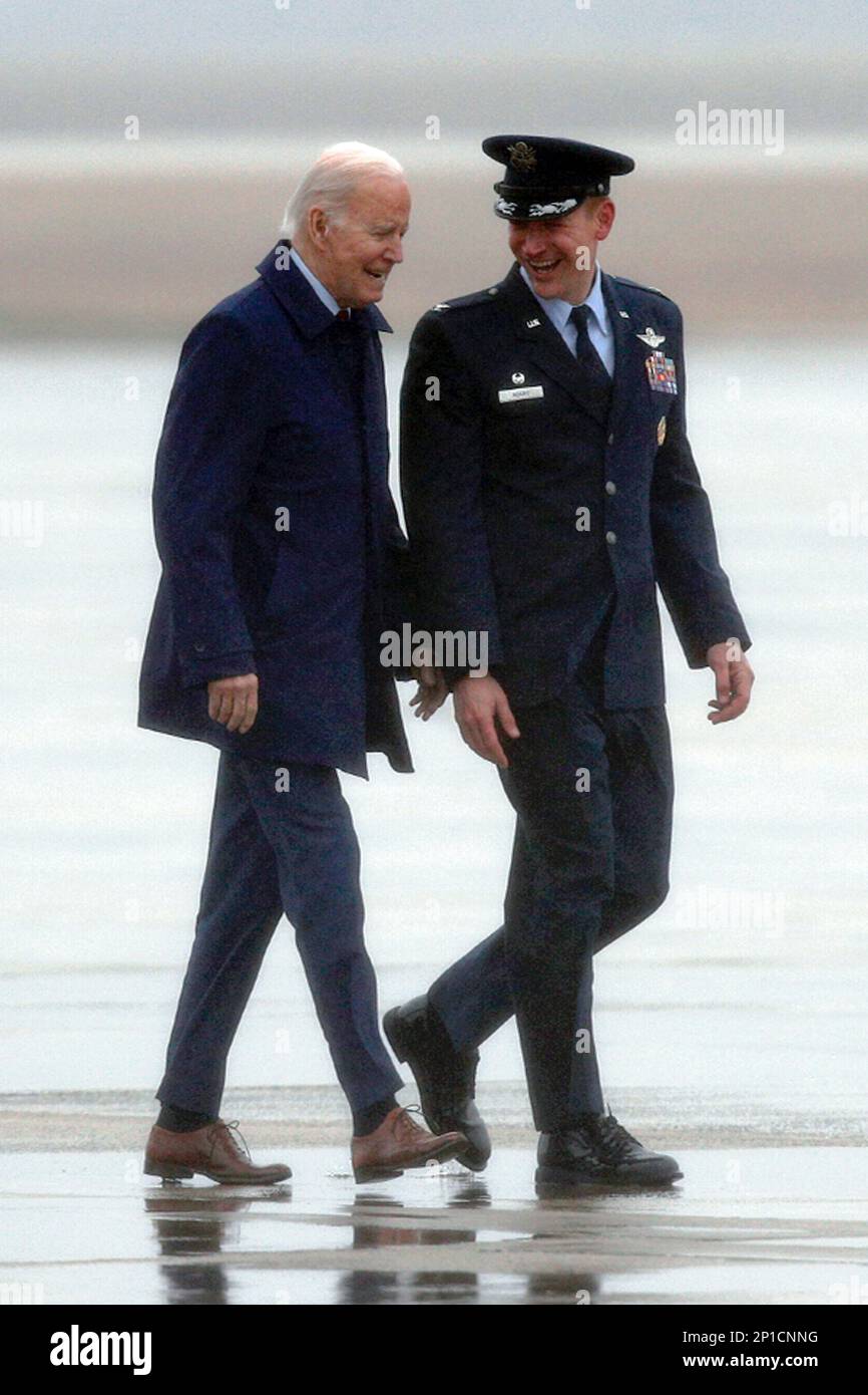 President Joe Biden is escorted by Col. Gregory Adams, Commander of the ...