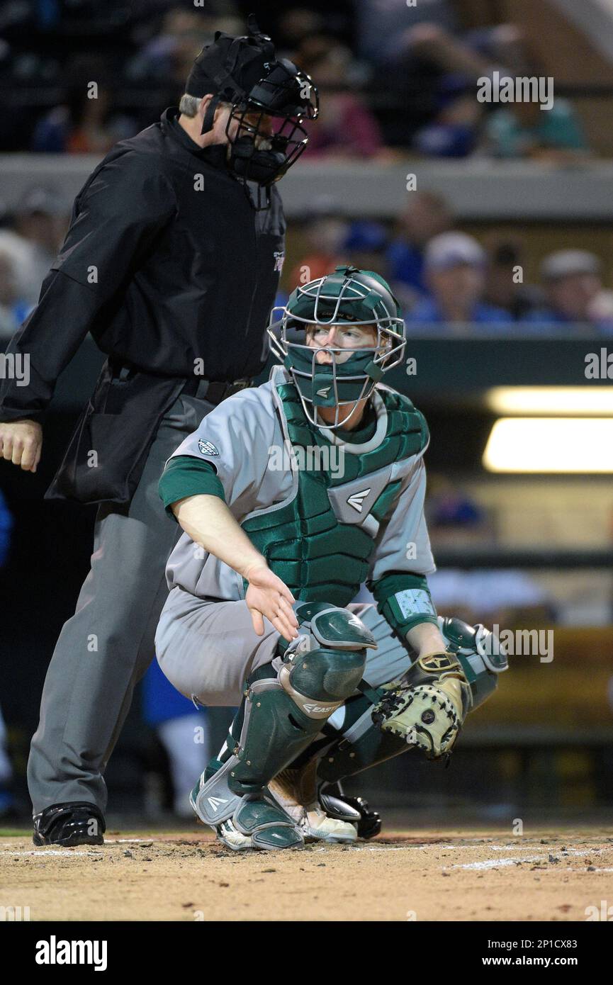 Eastern Michigan catcher Jeremy Stidham, checks for a signal from the ...