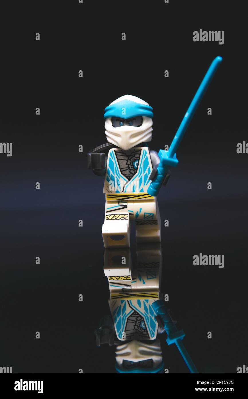 Lego ninjago minifigure Zane with black background and reflection Stock ...