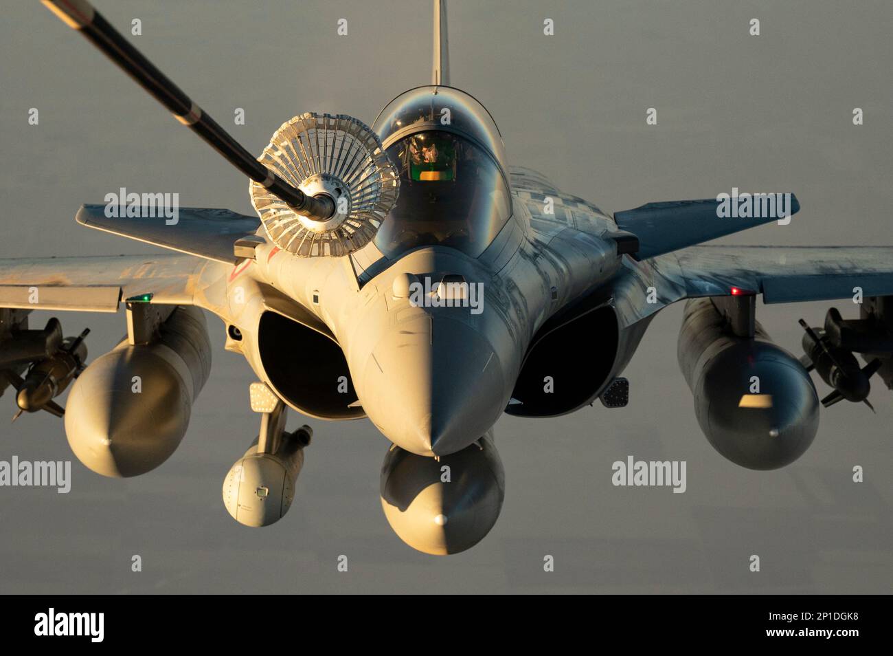 A French Rafale fighter aircraft prepares to receive fuel from a U.S ...