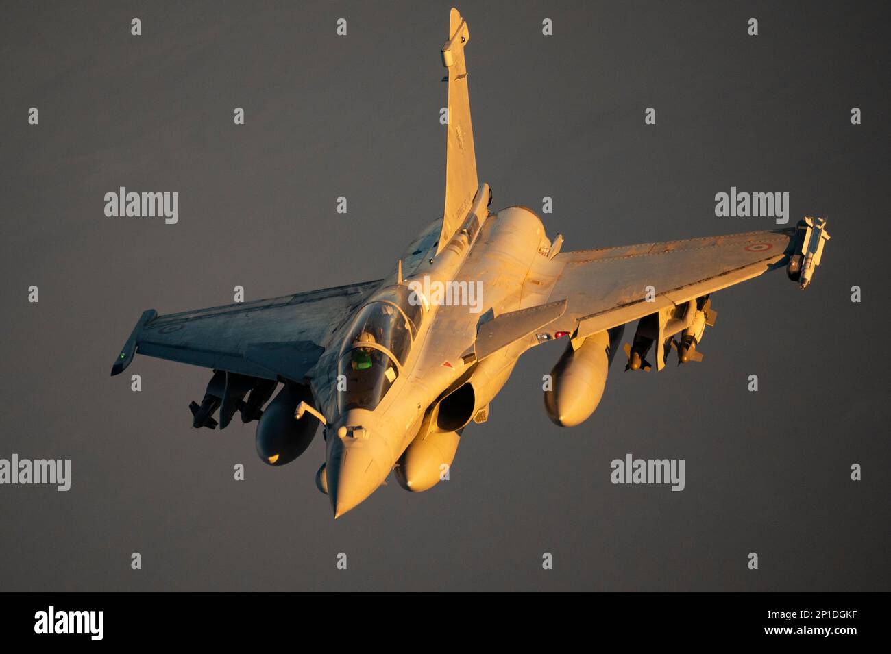 A French Rafale fighter aircraft prepares to receive fuel from a U.S ...