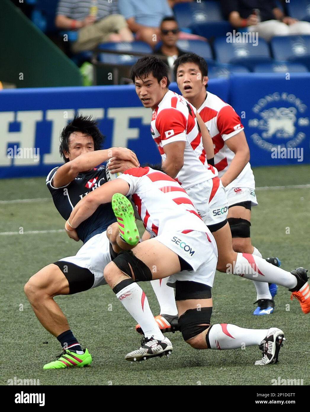 Players of Japan (red and white) and Hong Kong compete in a men's match ...