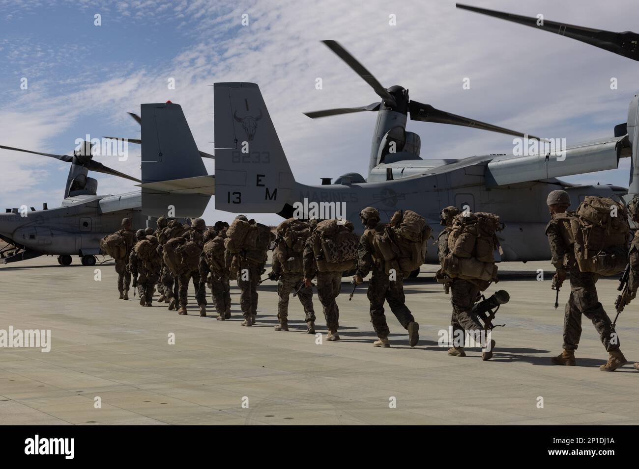 U.S. Marines with 3rd Battalion, 5th Marine Regiment, 1st Marine Division, get into an MV-22B ...