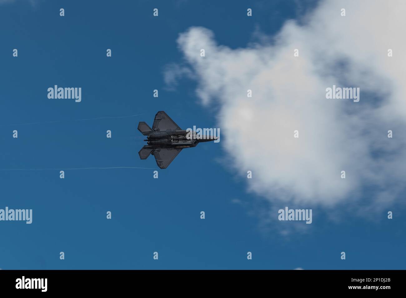 A U.S. Air Force F-22 Raptor flies over Davis-Monthan Air Force Base ...
