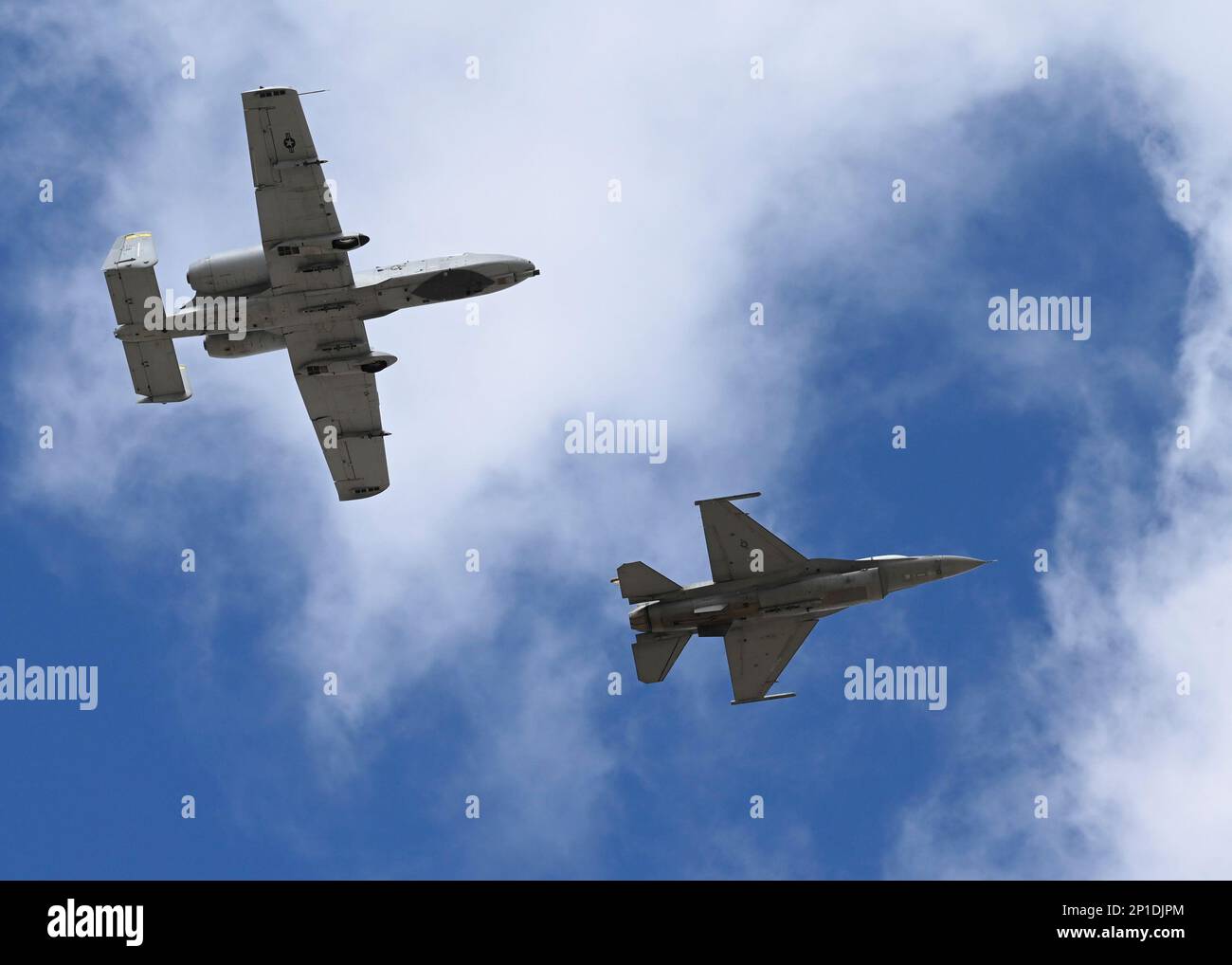 A U.S. Air Force A-10C Thunderbolt II flies alongside an F-16 Fighting ...