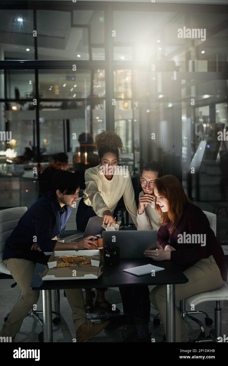 Designing your dreams. Shot of a group of young designers working late ...