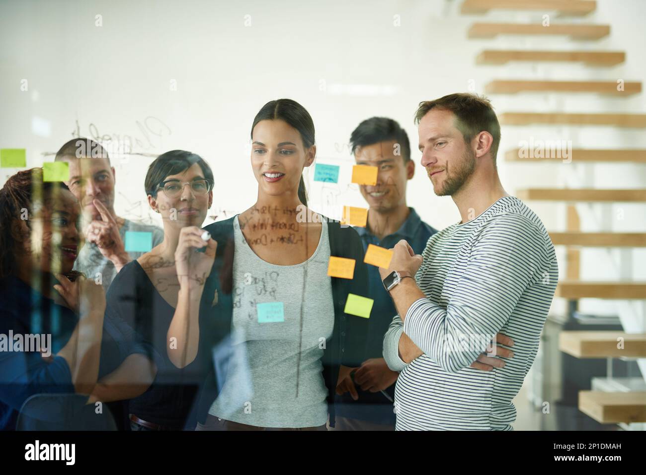 Planning is the first step. Cropped shot of a group of young designers ...