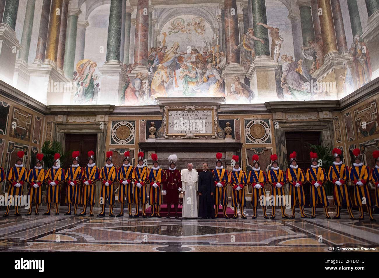 Pope Francis poses for a group photo during a private audience with the ...