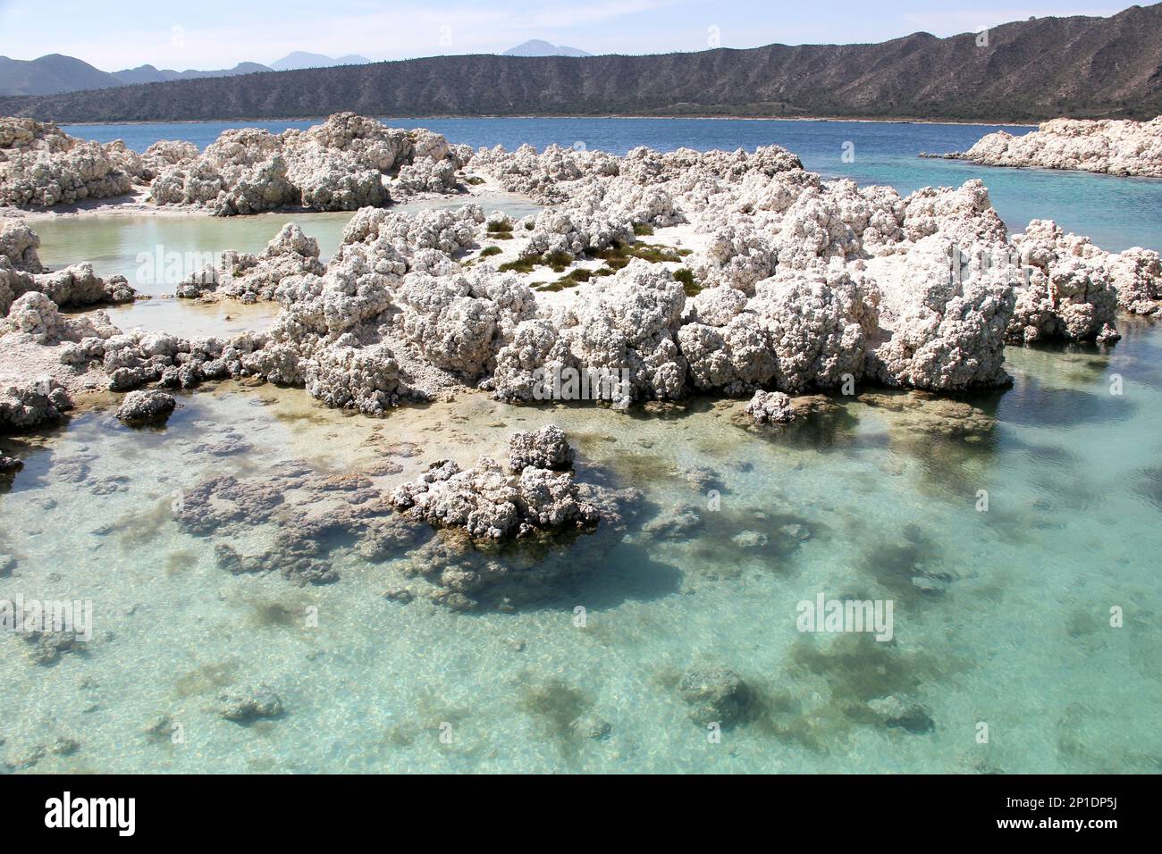 Landscape of white rock formations and body of water, lagoon of ...