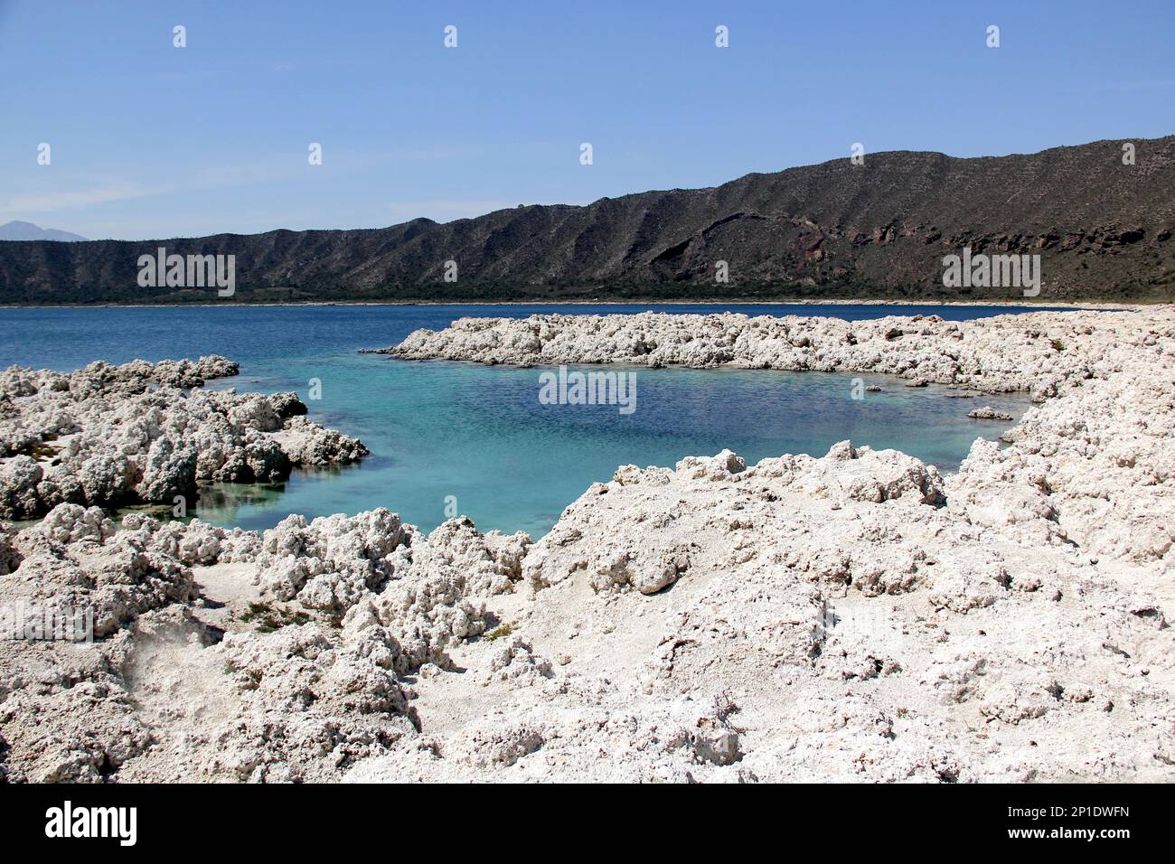 Landscape of white rock formations and body of water, lagoon of ...
