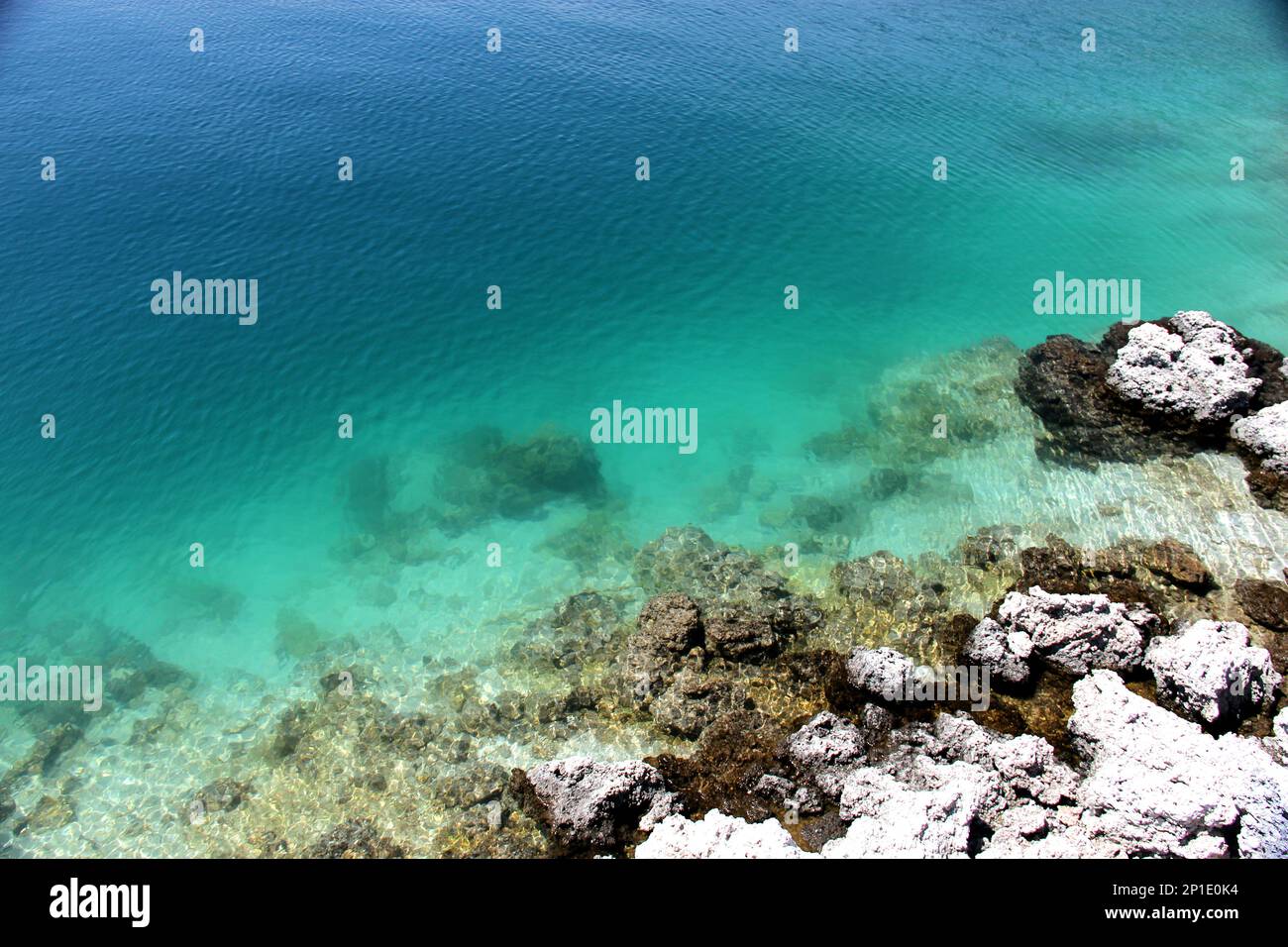Landscape of white rock formations and body of water, lagoon of ...