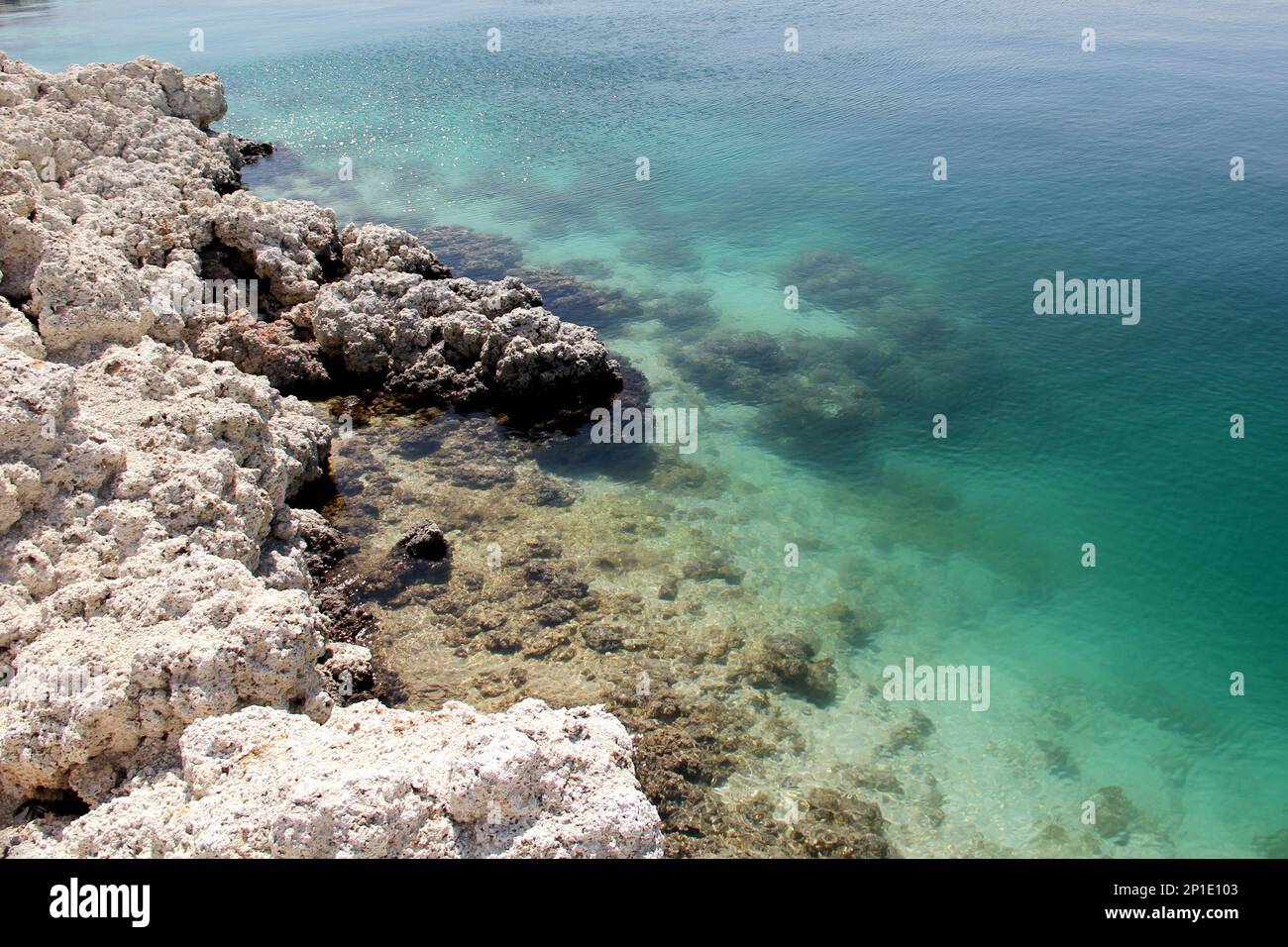 Landscape of white rock formations and body of water, lagoon of ...