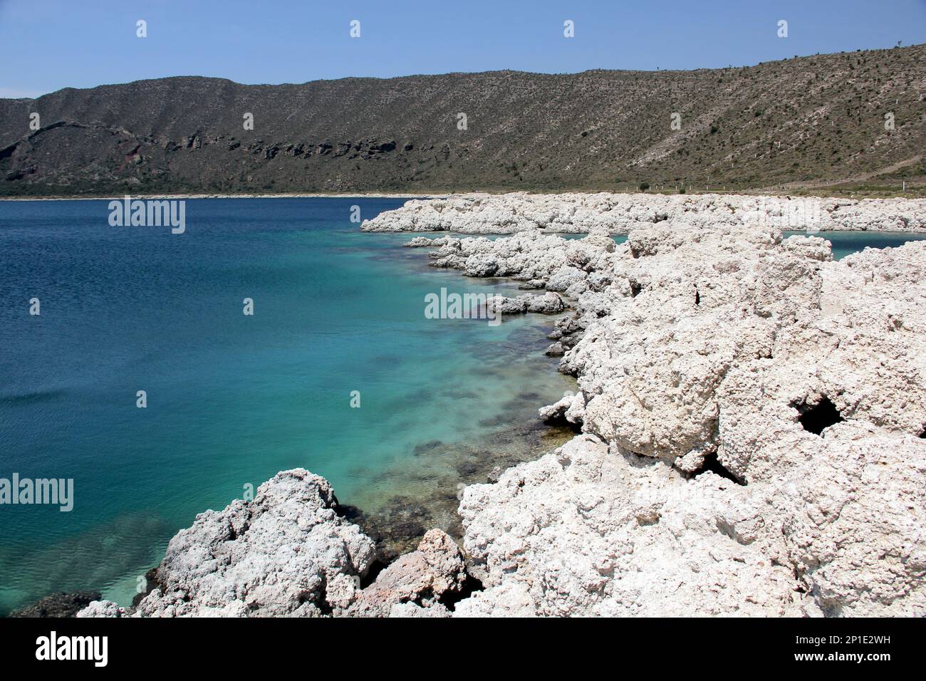 Landscape of white rock formations and body of water, lagoon of ...