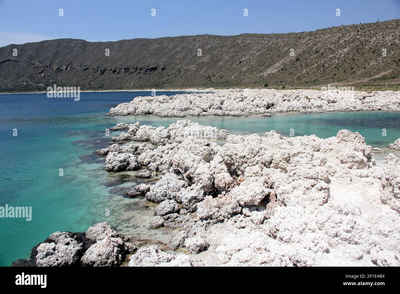 Landscape of white rock formations and body of water, lagoon of ...