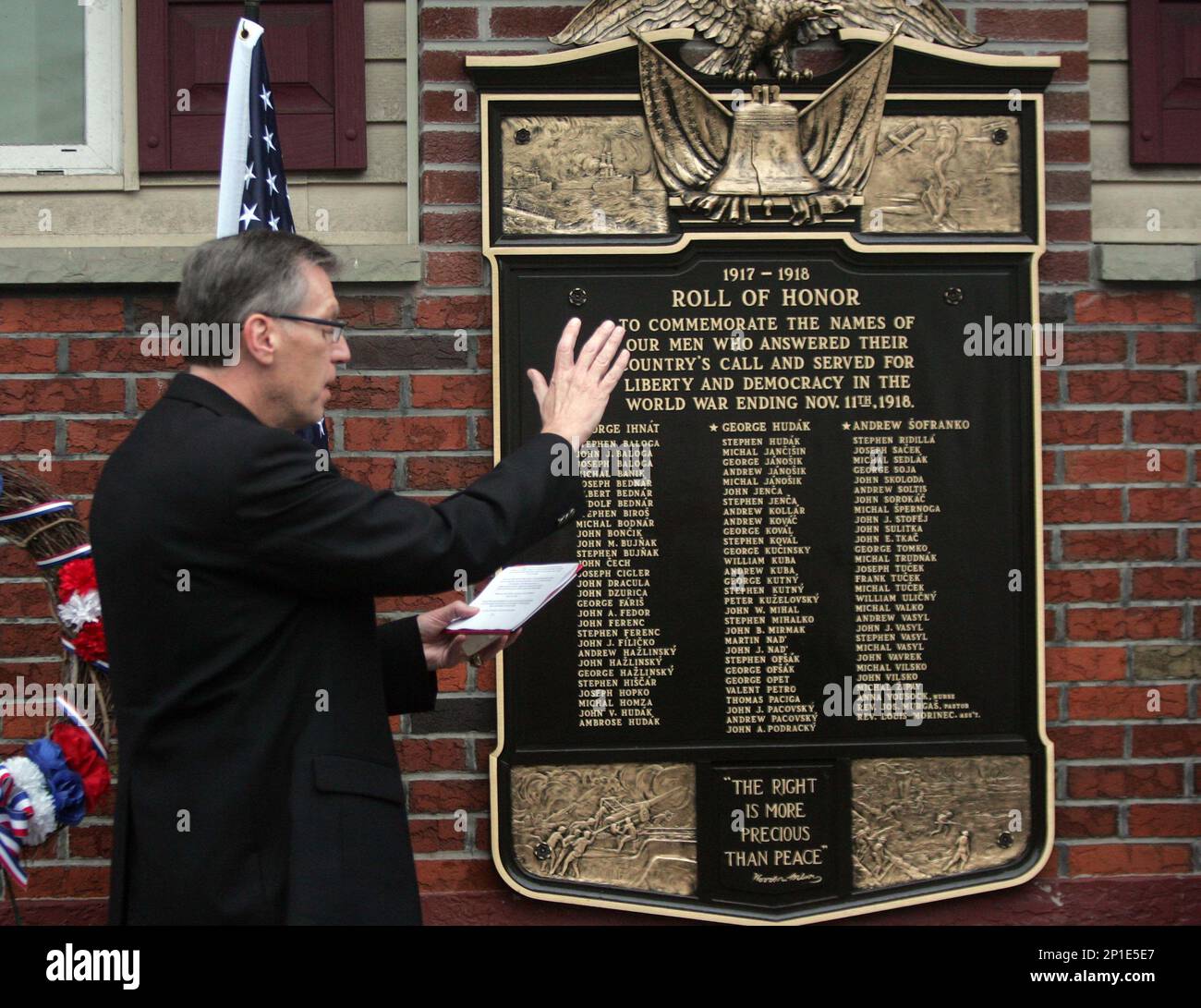 Father Andrew Hvozdovic blesses a World War One Roll of Honor plaque ...