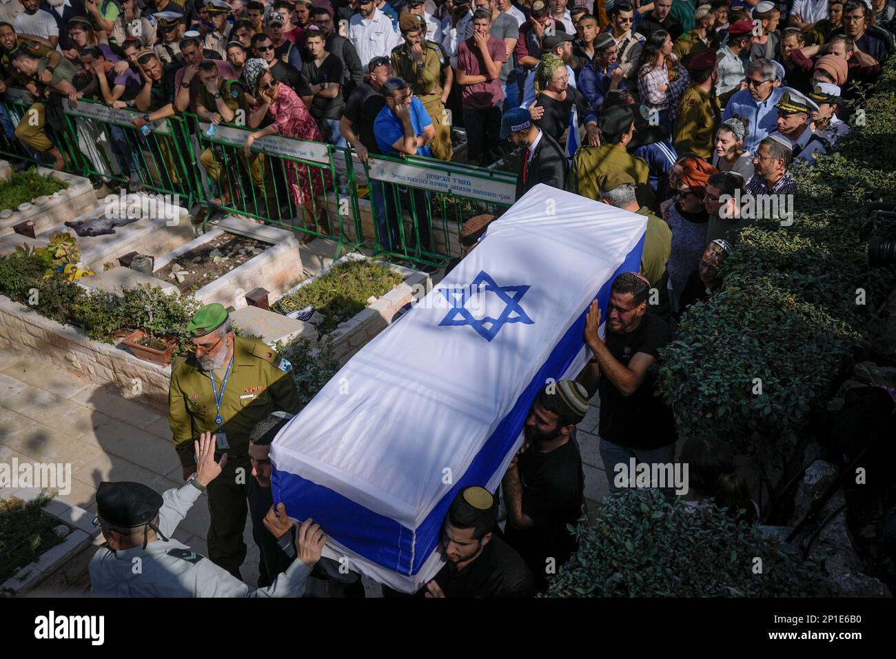 Mourners carry the flag-draped coffins of Hillel Yaniv, 21, and Yagel ...