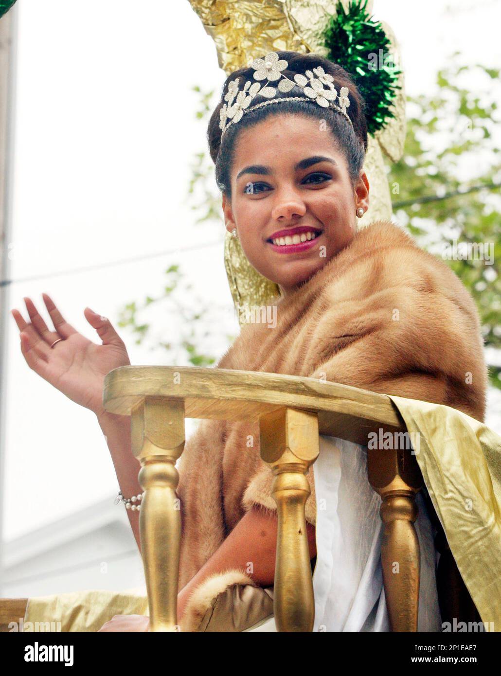 Queen Shenandoah LXXXIX Ahna Cameron rides atop a float Saturday, April ...