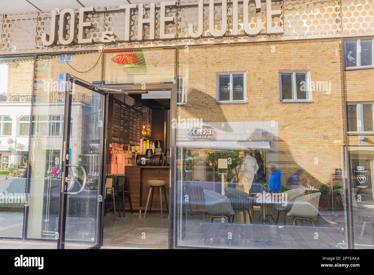 Close-up view of open door to café Joe and the juice. Sweden. Uppsala ...
