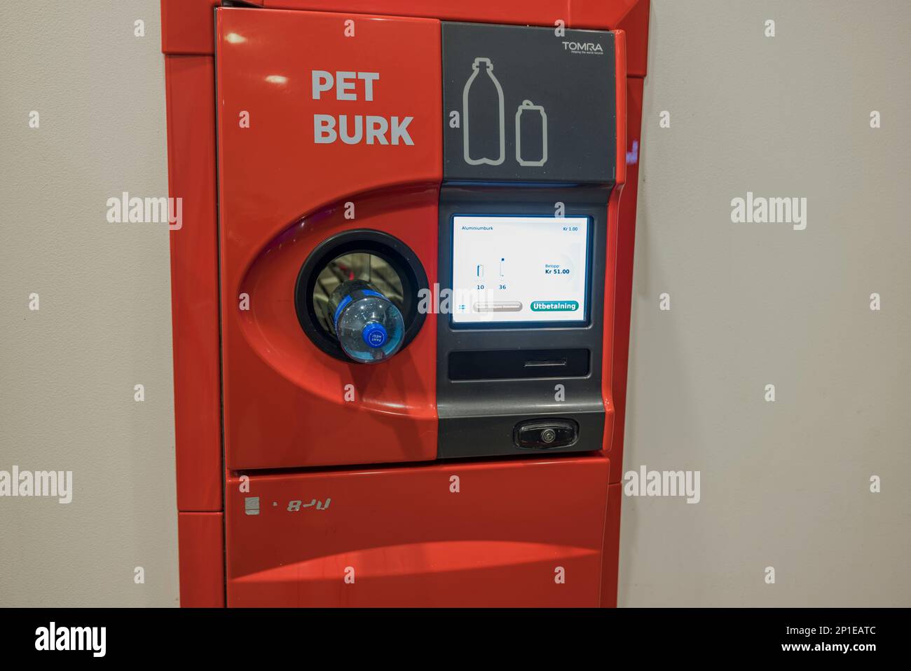 Close up view of putting plastic bottle to recycling automatic machine ...