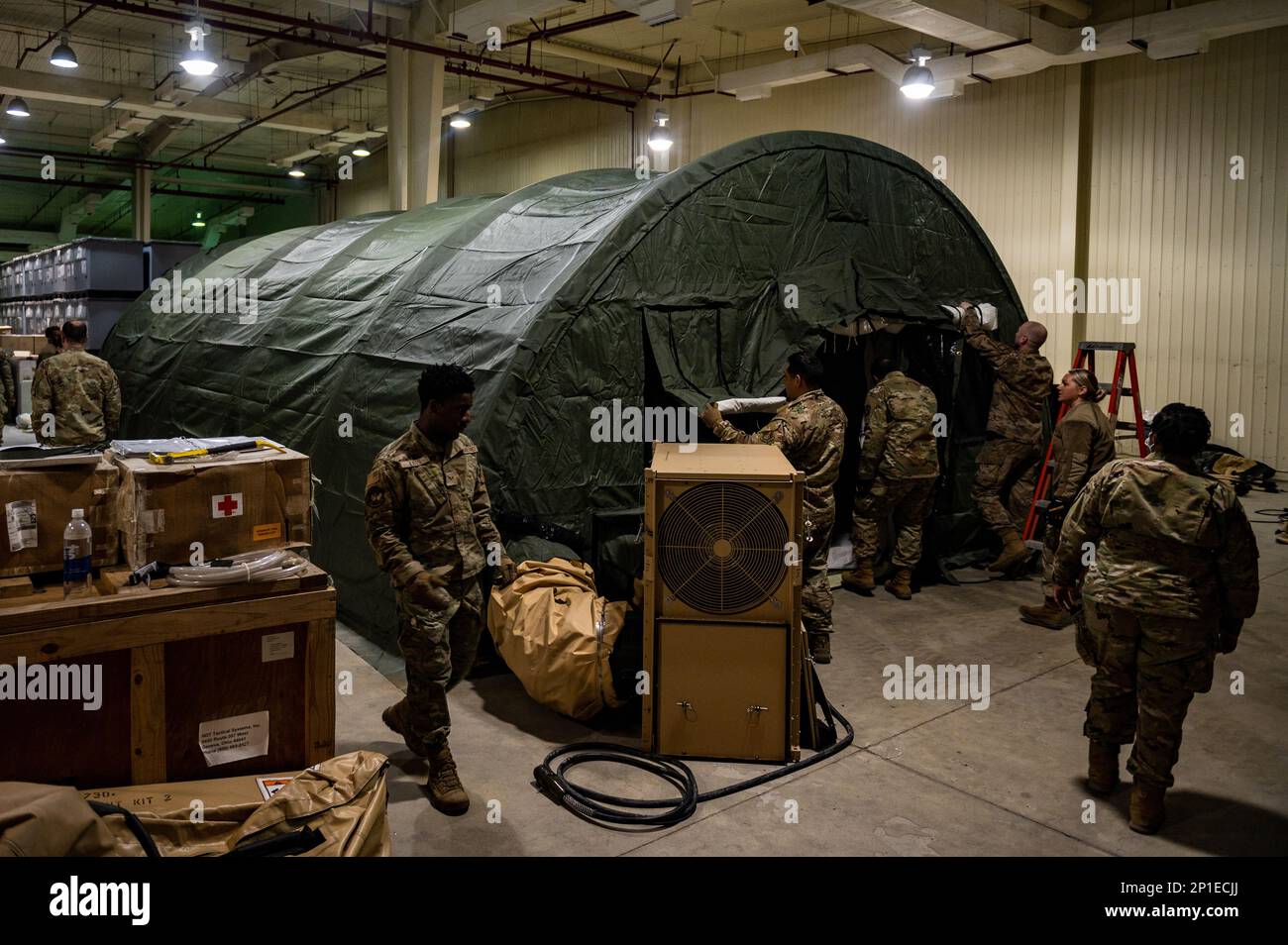 U.S. Air Force Airmen from the 51st Medical Group begin assembling a ...