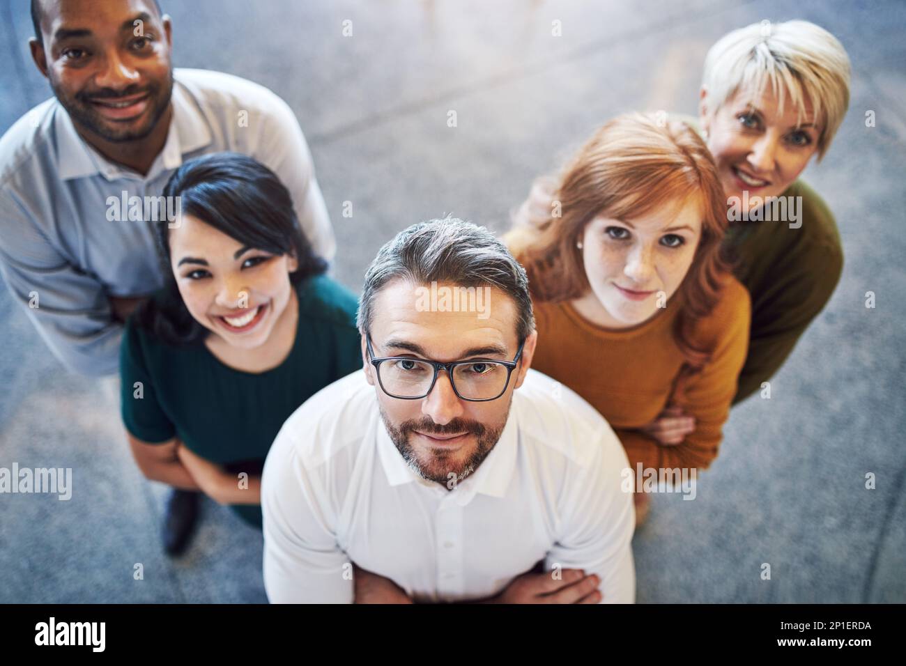 Setting our sights on higher goals. High angle portrait of a team of ...