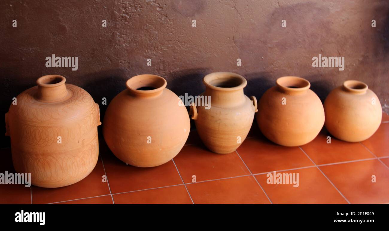 View of natural clay pots and jars on the ground Stock Photo - Alamy