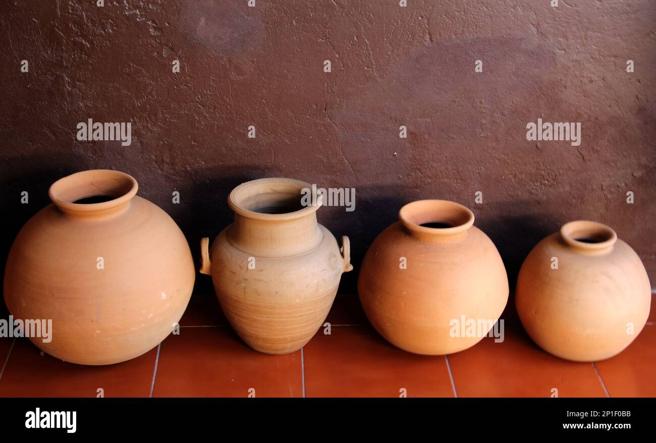 View of natural clay pots and jars on the ground Stock Photo - Alamy