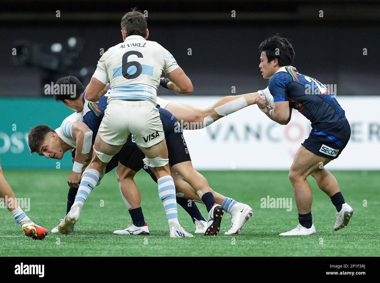 Japan's Kippei Ishida, right, grabs Argentina's Matteo Graziano by the ...