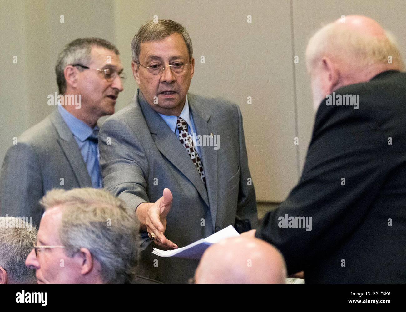 Charles Ridulph, center, Maria Ridulph's brother, takes a petition ...